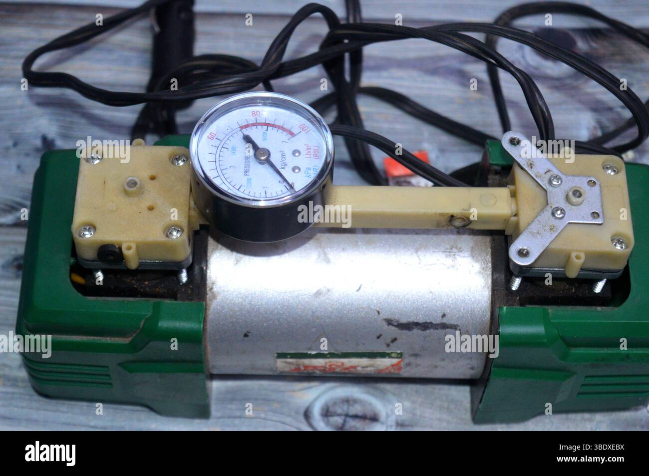 Cairo, Egypt, May 25 2025: maintenance of an auto car air compressor ...