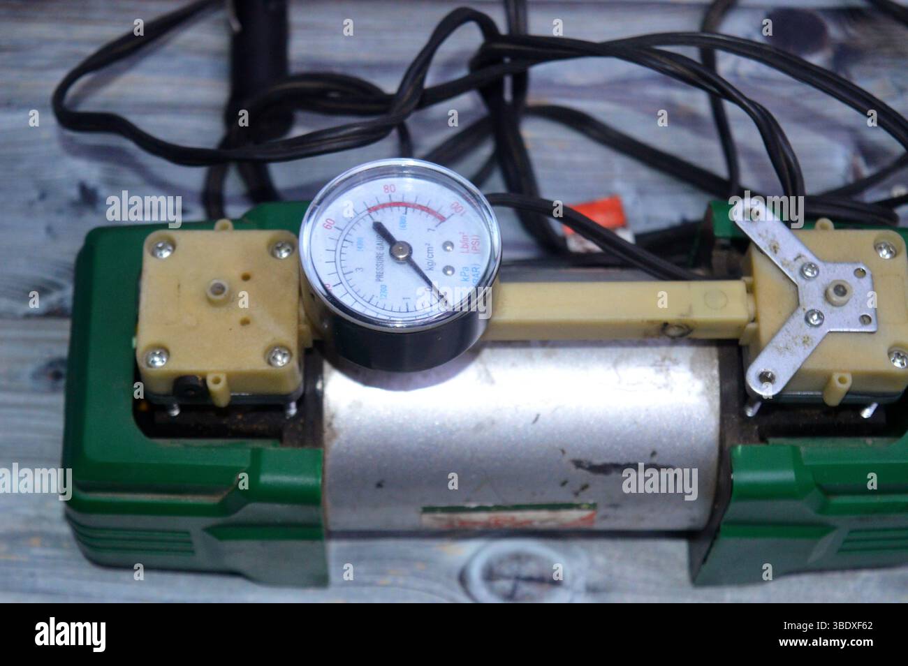 Cairo, Egypt, May 25 2025: maintenance of an auto car air compressor ...