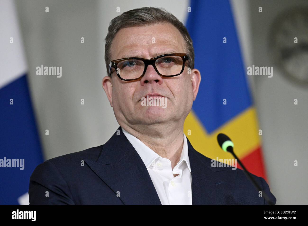 Prime Minister of Finland Petteri Orpo listens during a joint press ...