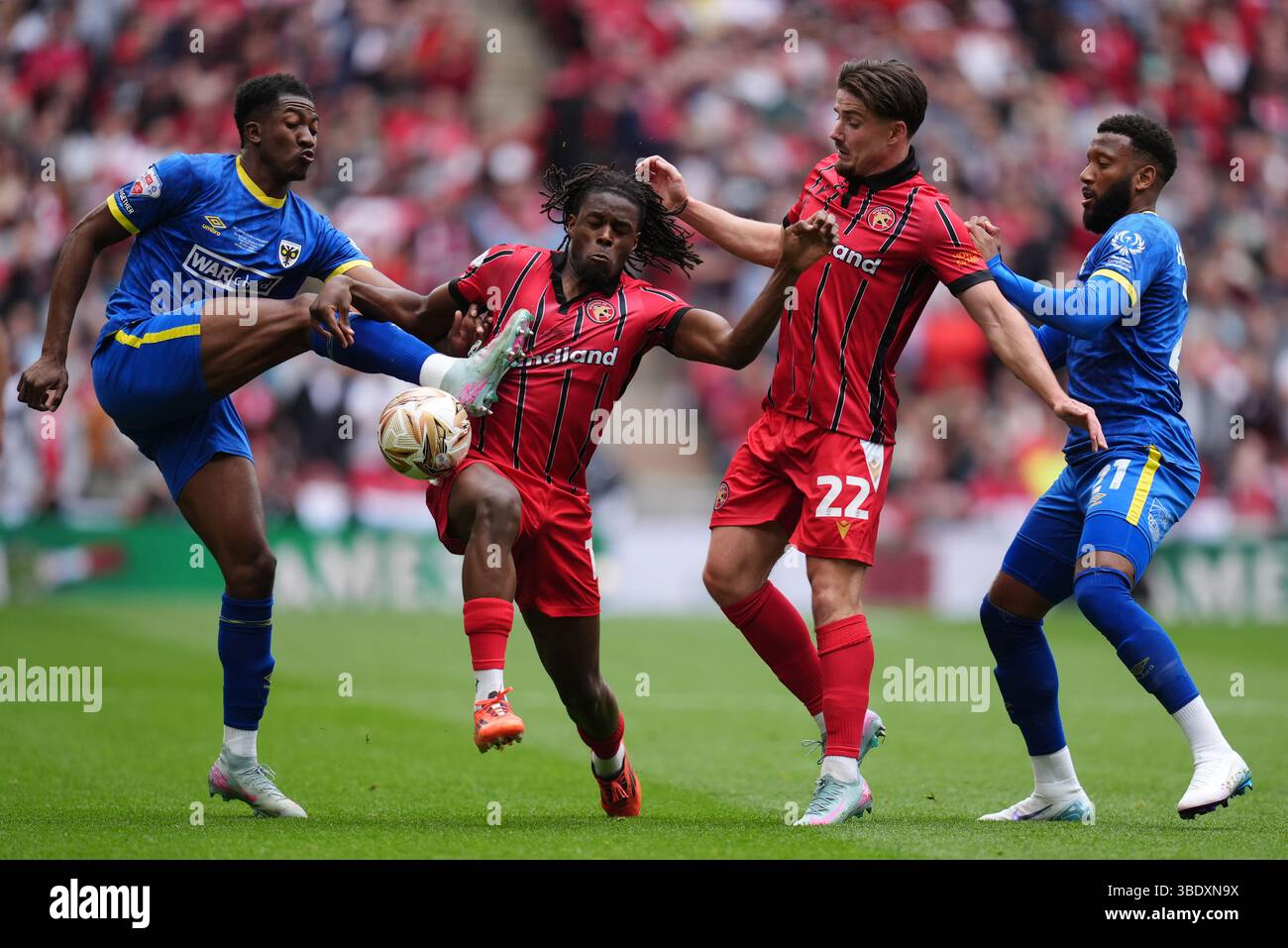AFC Wimbledon's Josh Neufville (left) and Walsall's Nathan Asiimwe ...