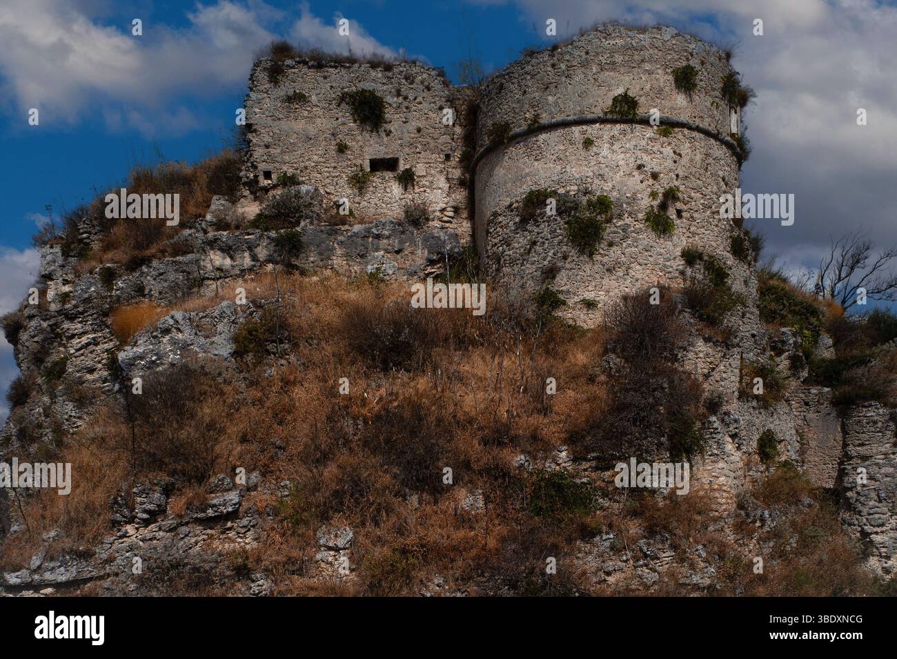 Strong rubble walls on a towering rock: the ancient moated Castello ...