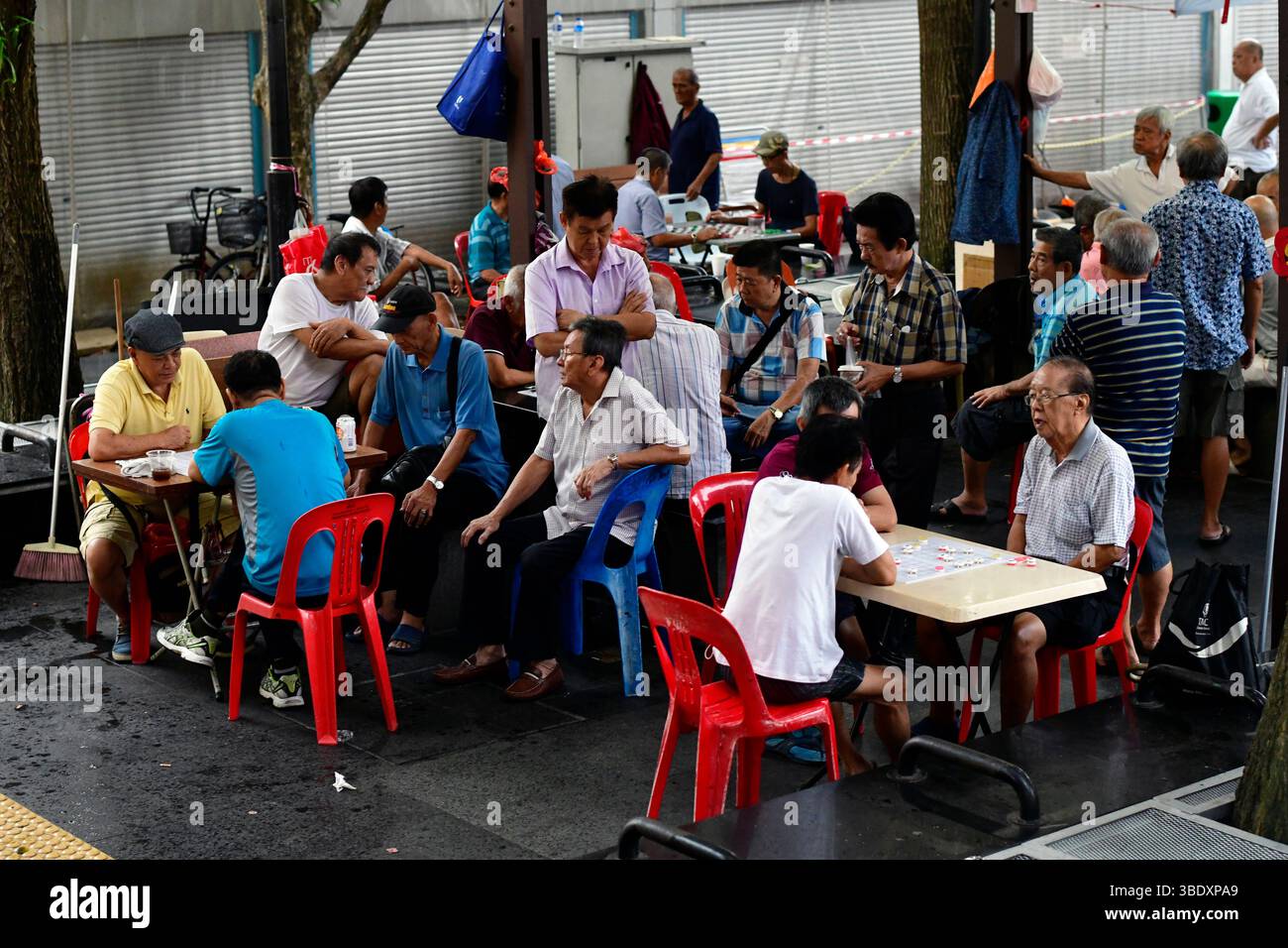 Groups of people congregate to play draughts and other board games on ...