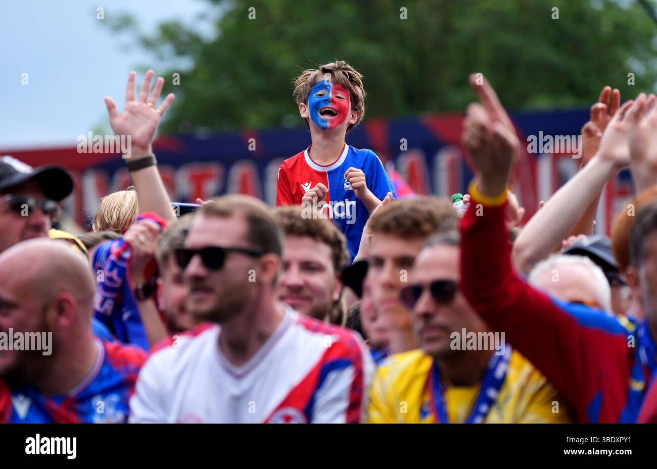 Crystal Palace fans watching the players celebrate on stage with the ...