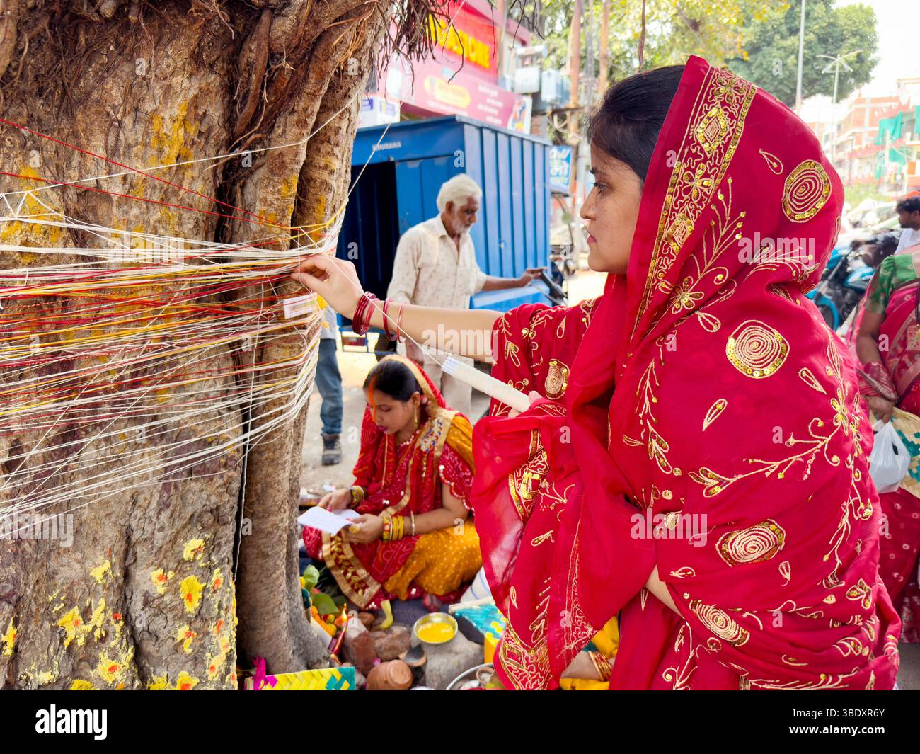 Married Hindu women perform rituals around a banyan tree on Vat Savitri ...