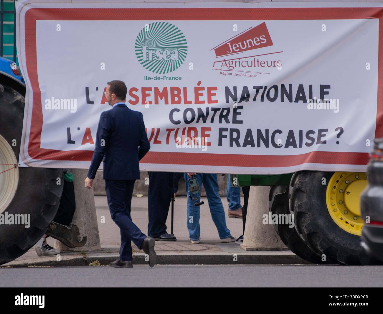 Paris, France. 26th May, 2025. Farmers park their tractors in front of ...