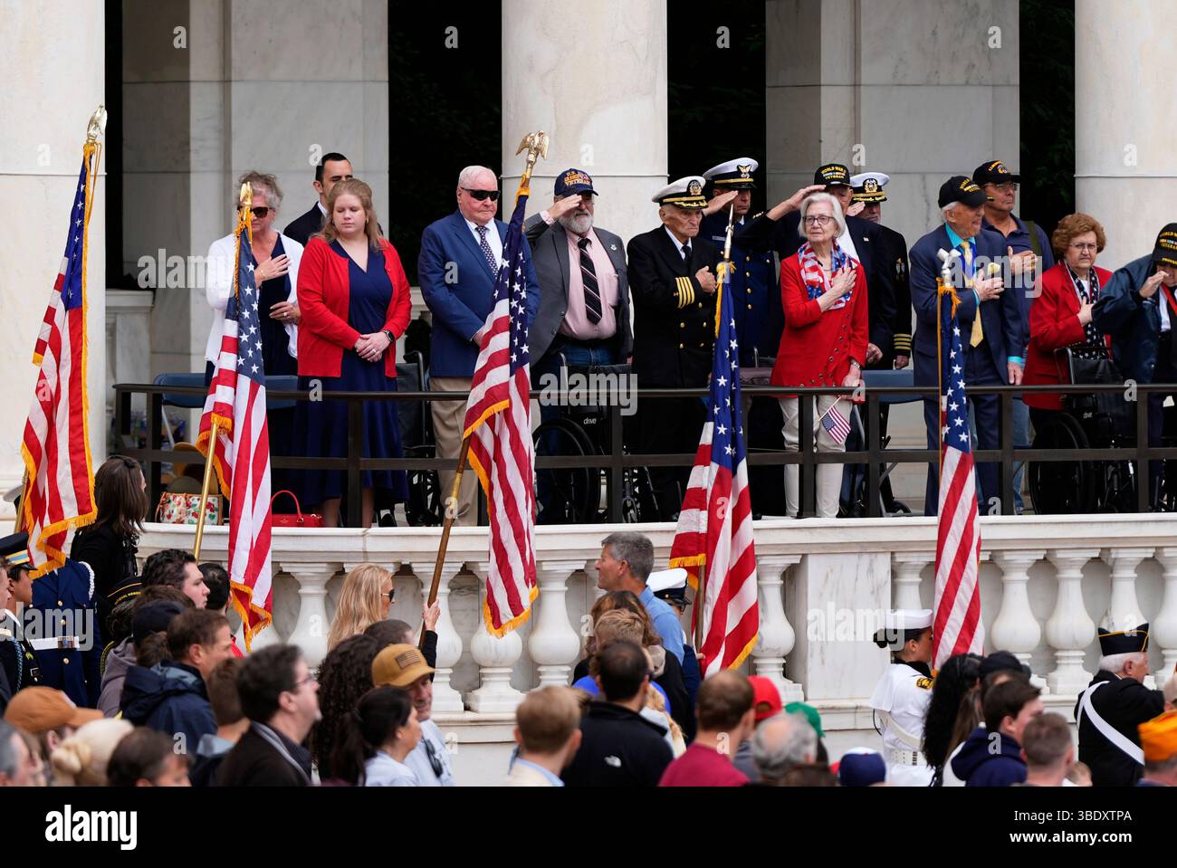 Dignitaries salute as U.S. flags arrive before President Donald Trump ...