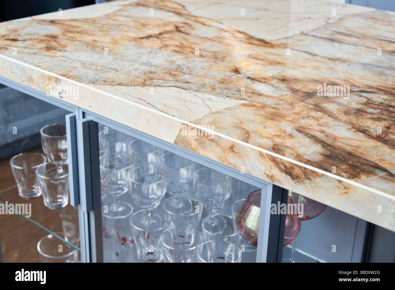 An Elegant Marble Countertop featuring a stunning Glassware Display for ...