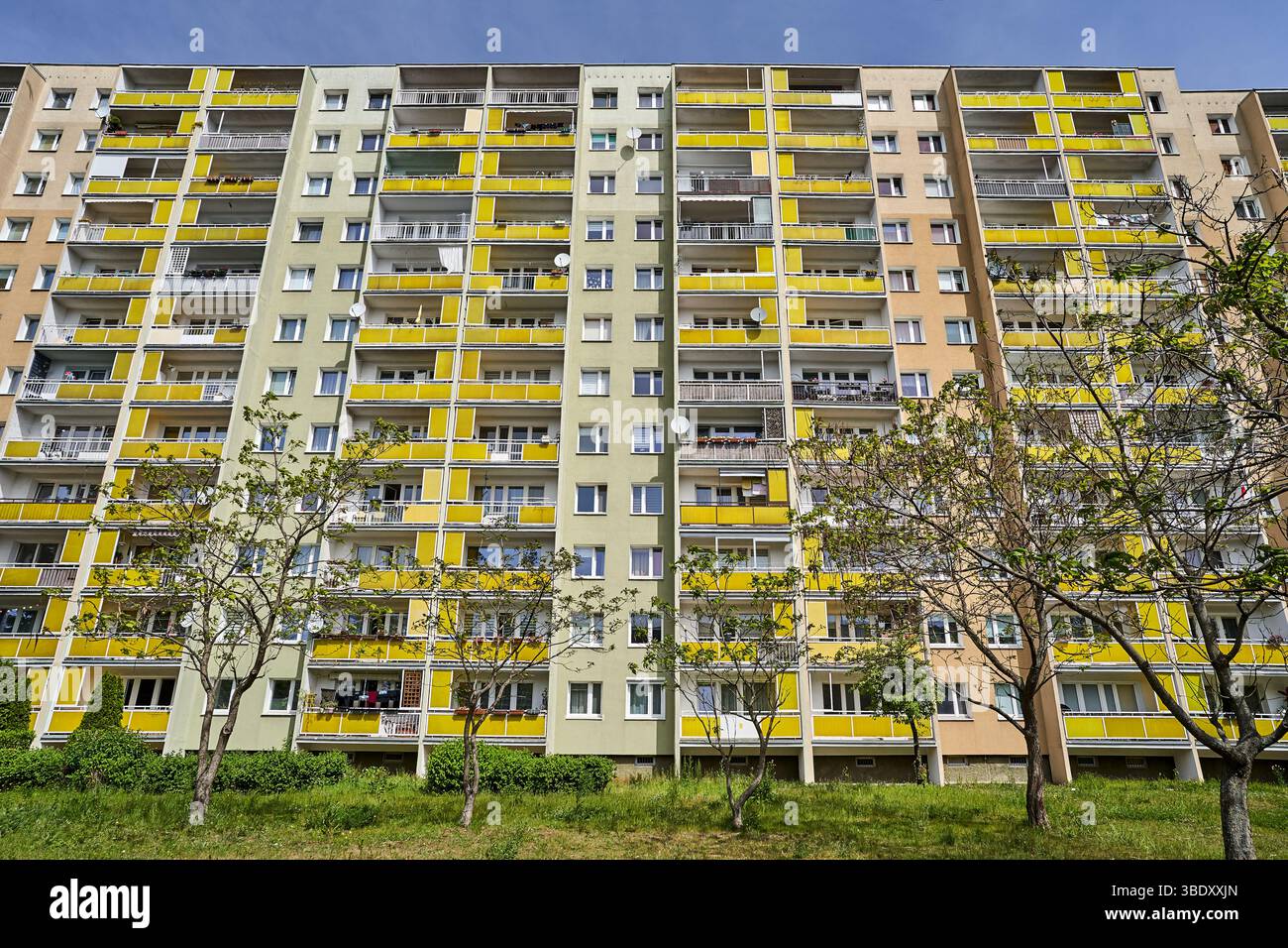 The facade with balconies of a residential high-rise building in Poznan ...