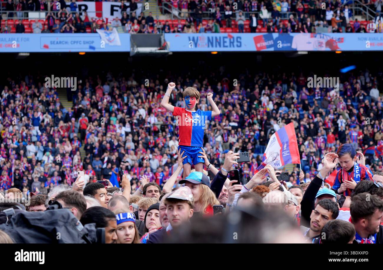 Crystal Palace fans watching the players celebrate on stage with the ...