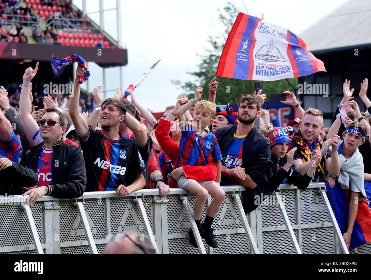 Crystal Palace fans watching the players celebrate on stage with the ...