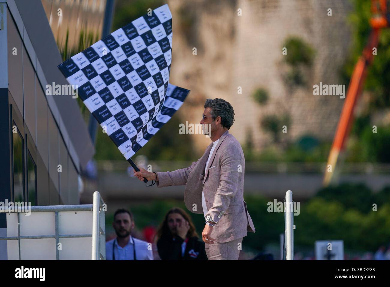 Patrick Dempsey with chequered flag during the Race of the Formula 1 ...