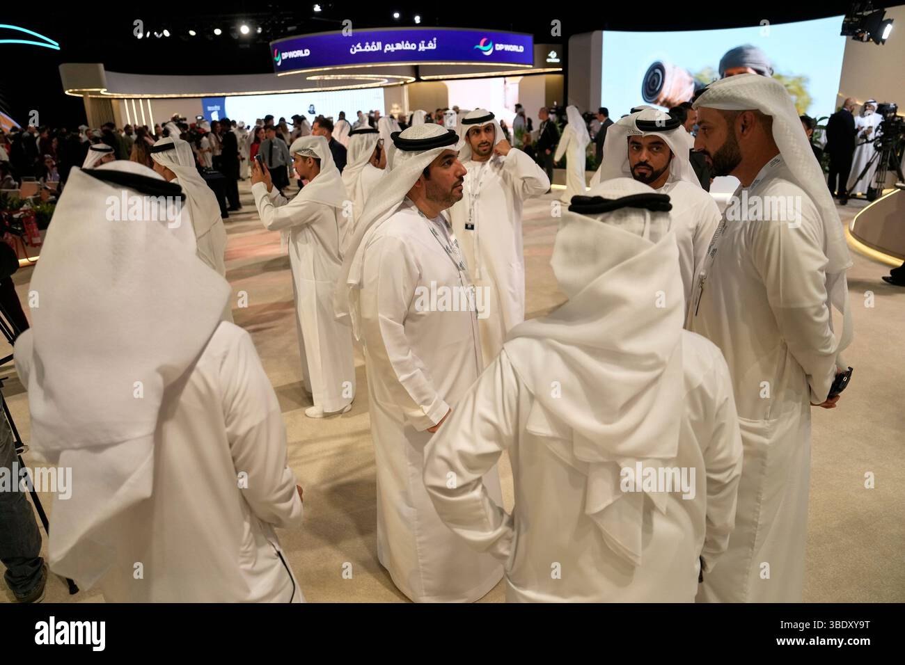 Visitors attend the opening day of the Arab Media Summit 2025 in Dubai ...