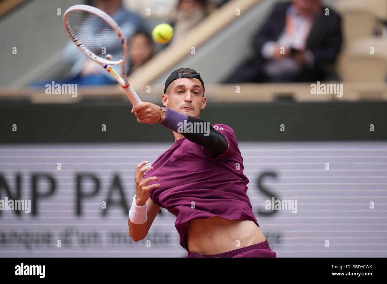 France's Terence Atmane returns the ball to France's Richard Gasquet ...