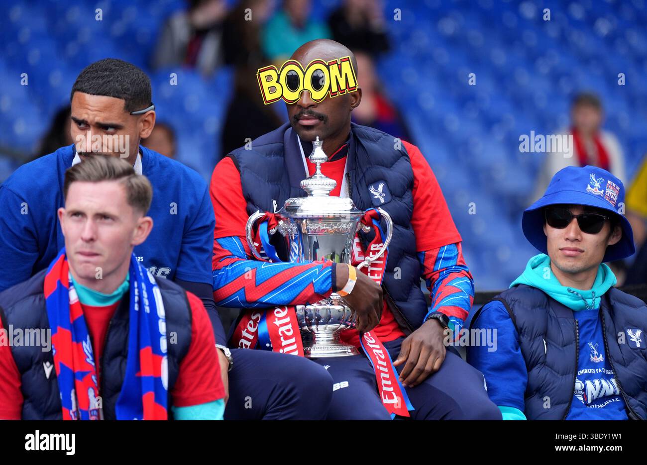 Crystal Palace's Jean-Philippe Mateta (centre) with the trophy on stage ...