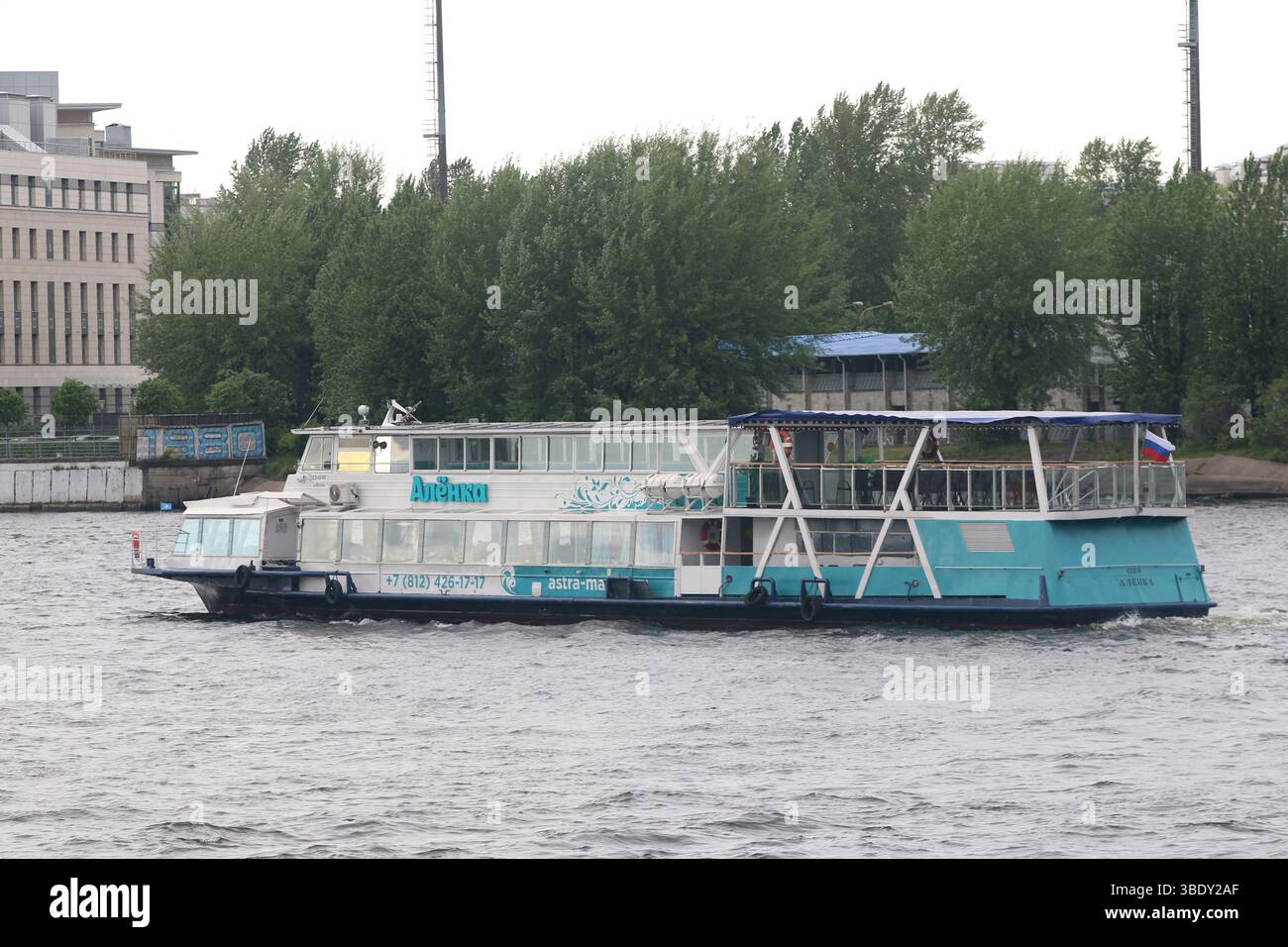 The pleasure boat Alyonka sails along the Malaya Neva River in St ...