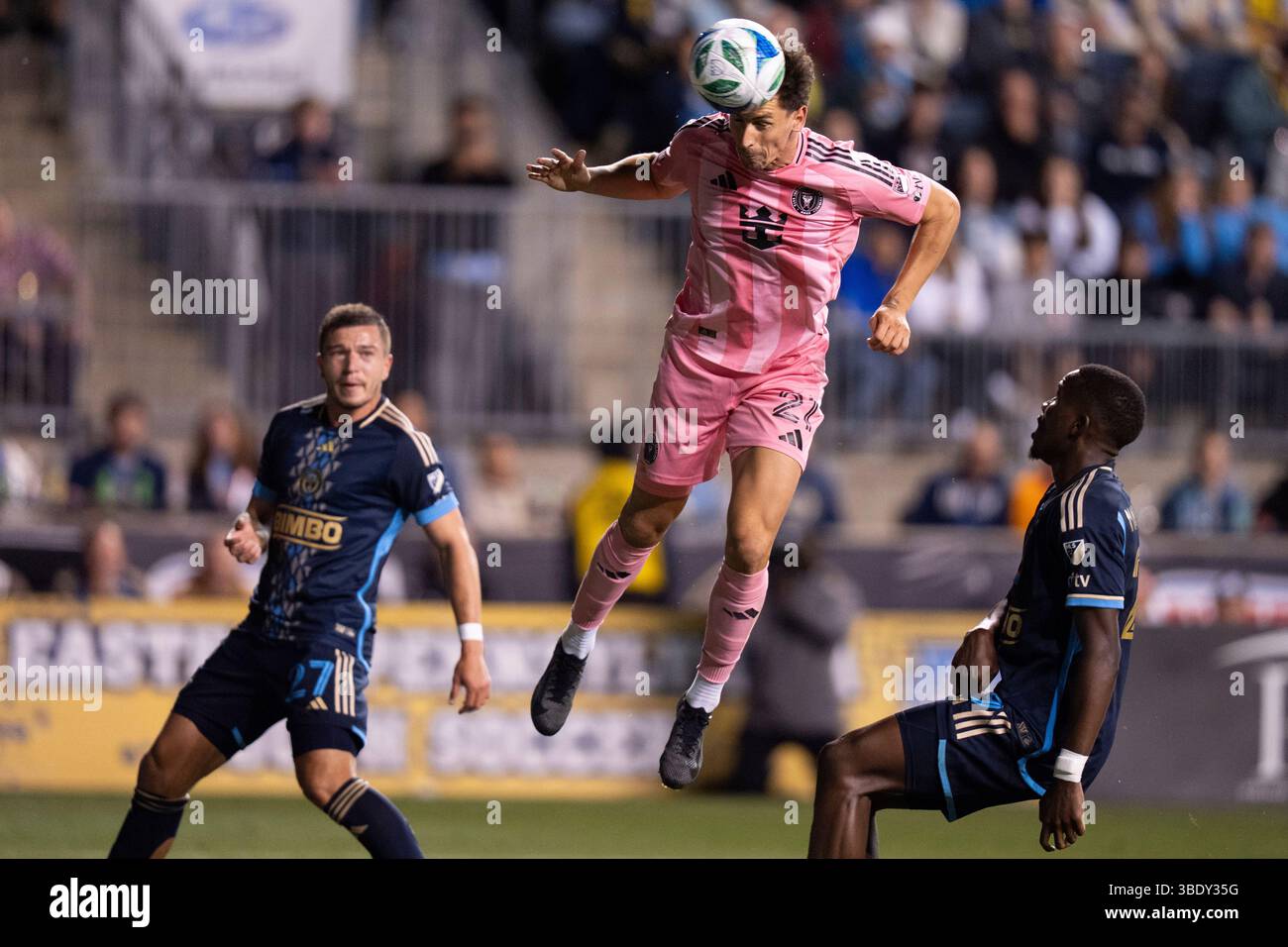 Inter Miami's Tadeo Allende, center, leaps to head the ball for a goal ...