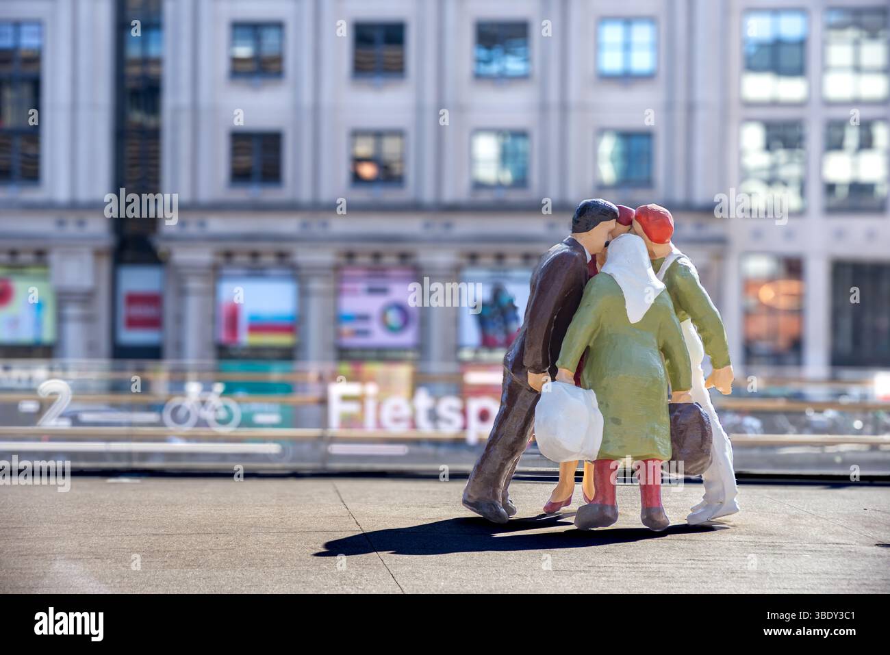 31.03.2025, Gent, Belgium, Small sculpture of four hugging, colorful ...