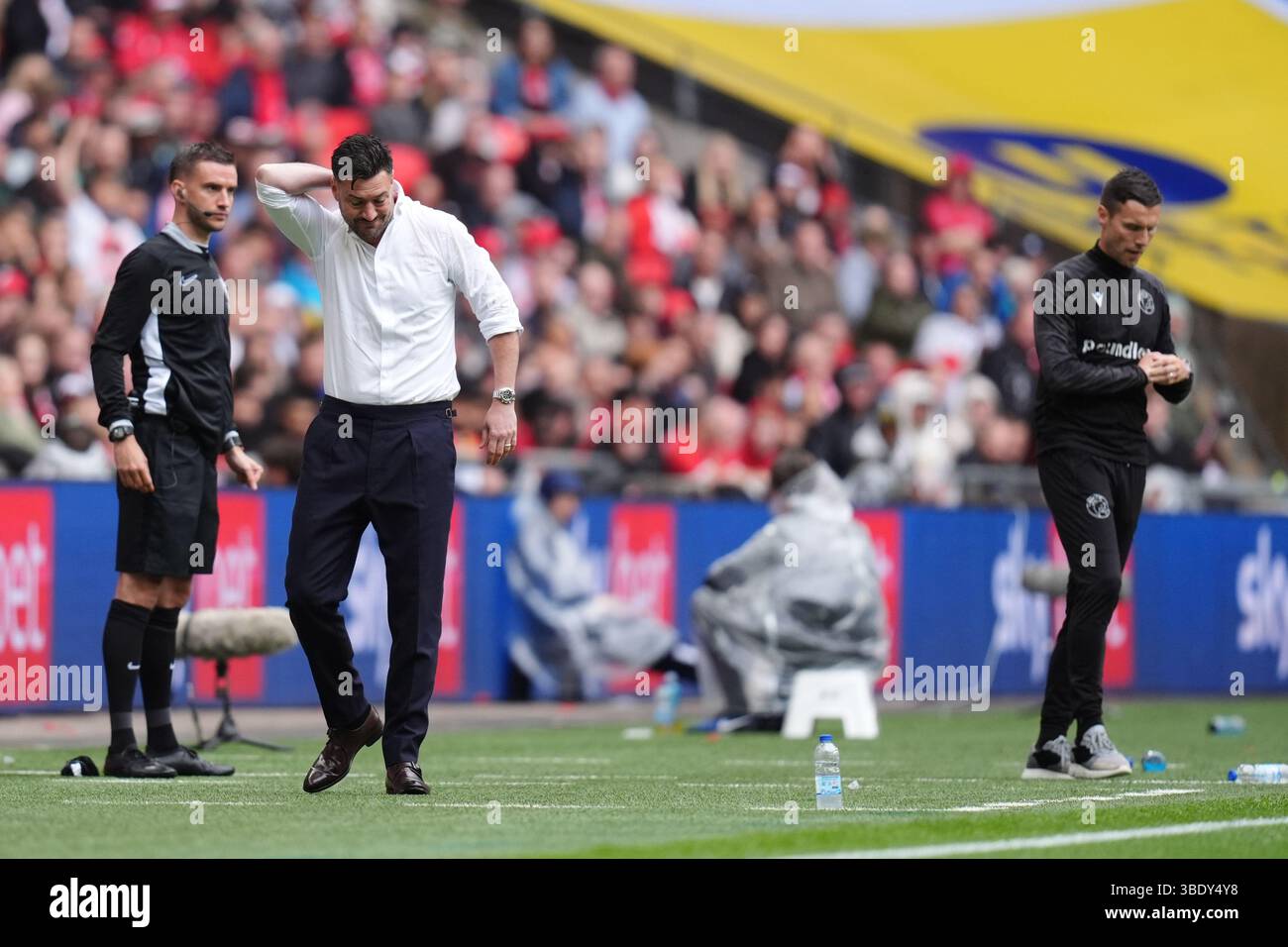AFC Wimbledon manager Johnnie Jackson (left) during the Sky Bet League ...