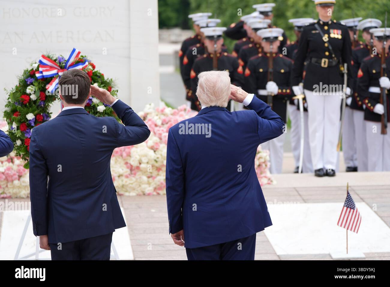 President Donald Trump, right, salutes at the Tomb of the Unknown ...