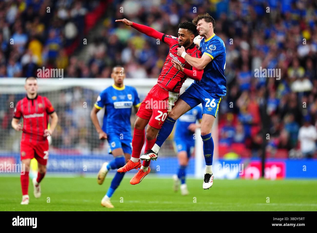 Walsall's George Hall and AFC Wimbledon's Riley Harbottle (right ...