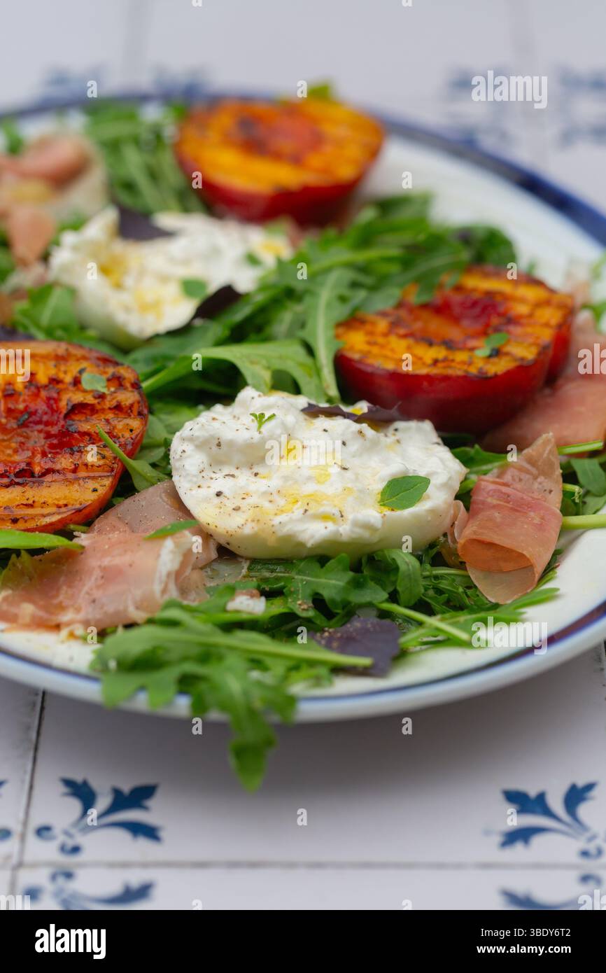 Italian burrata cheese prosciutto ham peach salad hi-res stock ...