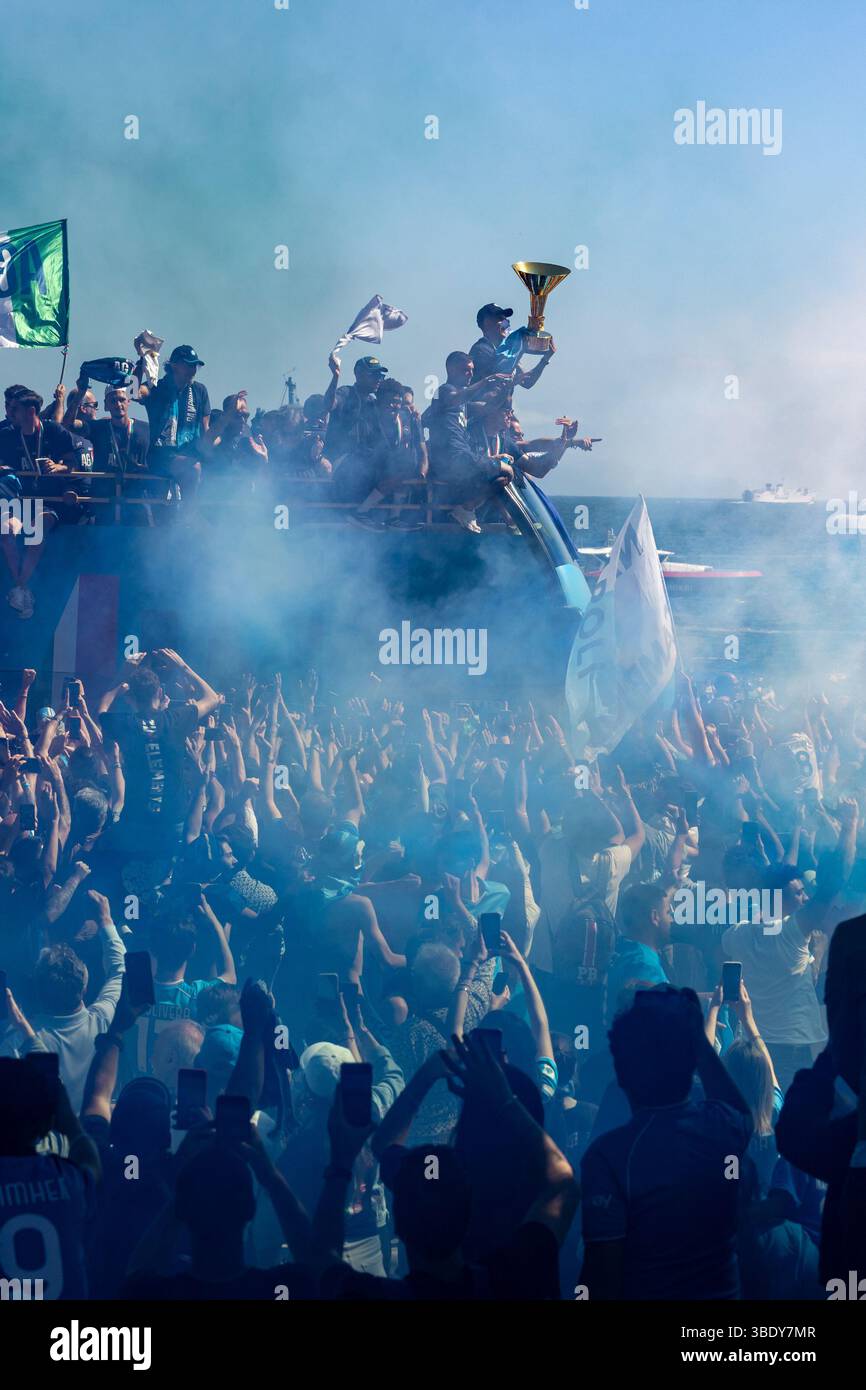 Napoli players and staff parade on a bus to celebrate the scudetto ...