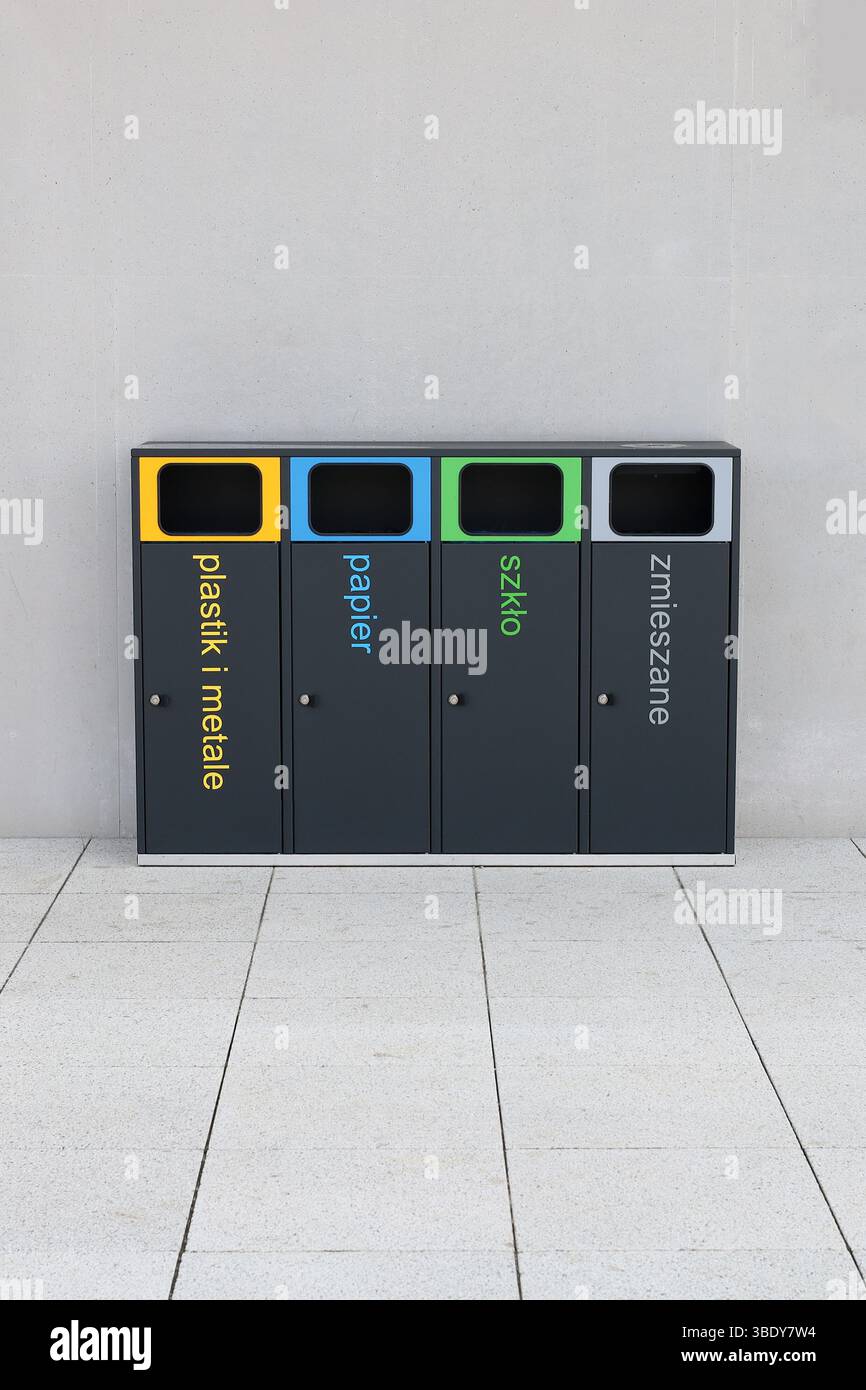 Vertical photo of modern recycling bins with minimalistic background ...