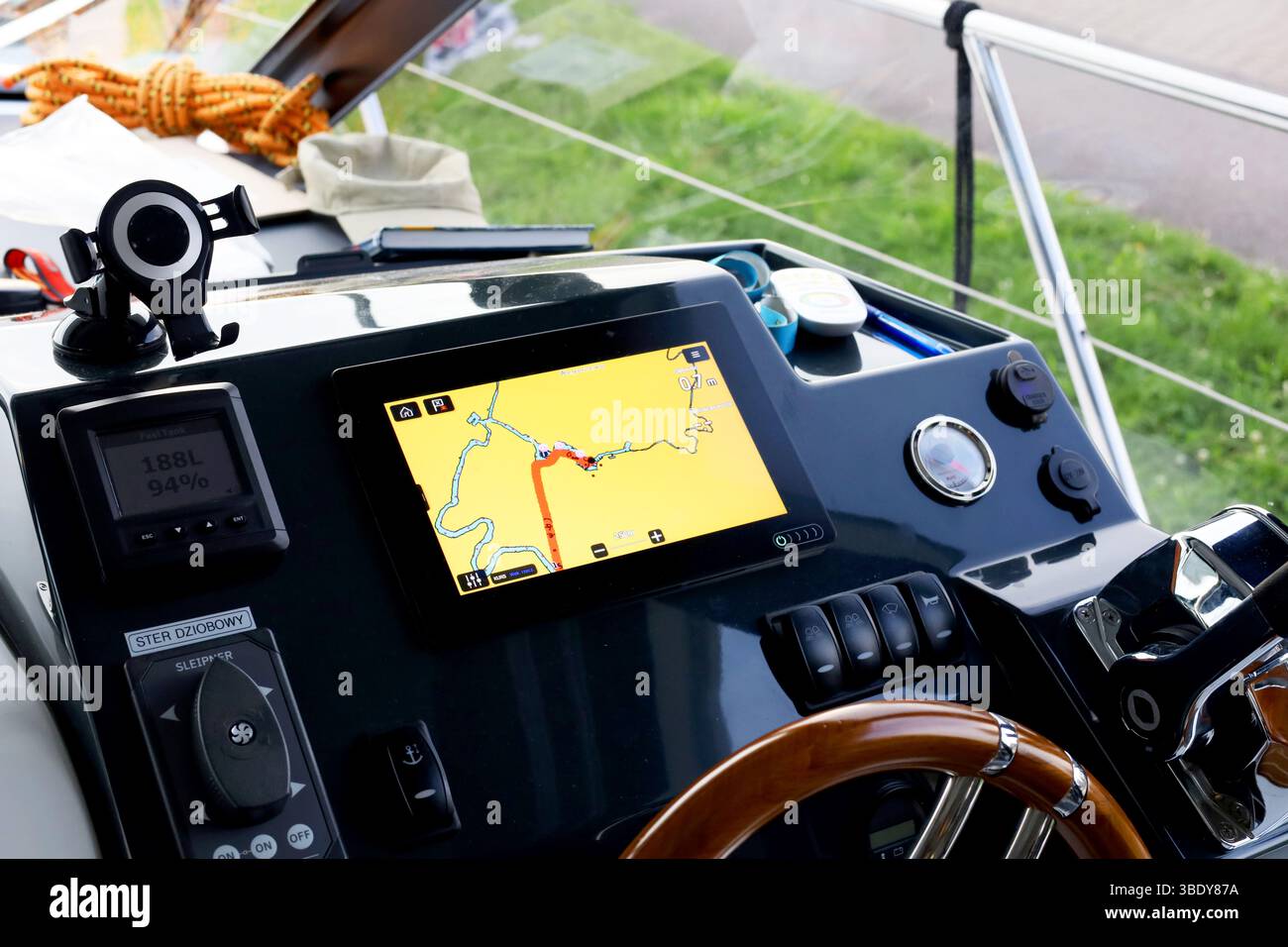 Motor boat steering panel view with steering wheel and navigation ...