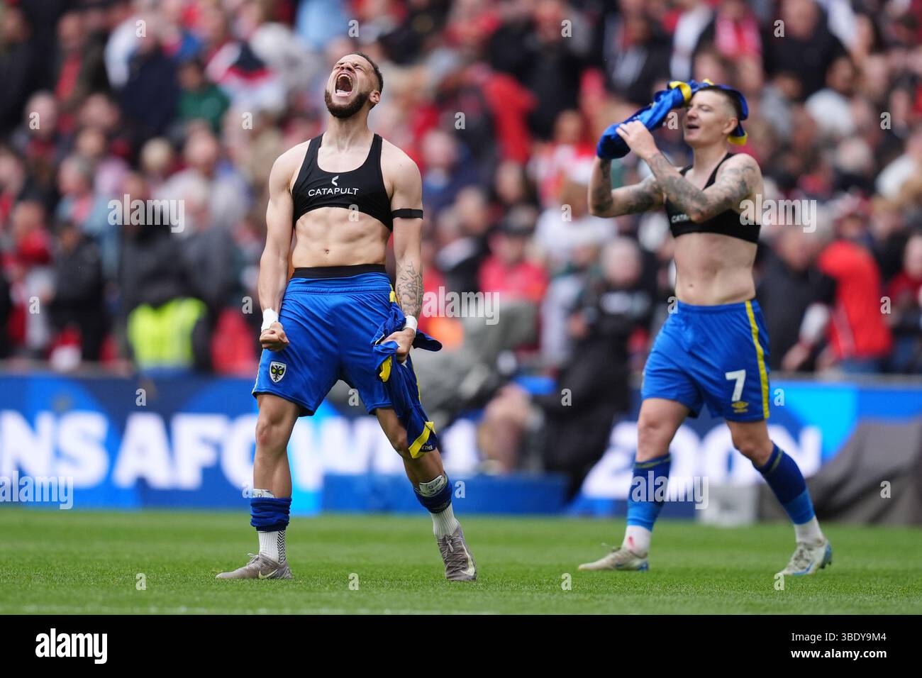 AFC Wimbledon's Marcus Browne (left) and AFC Wimbledon's James Tilley ...