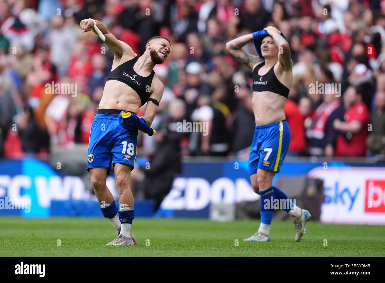 AFC Wimbledon's Marcus Browne (left) and AFC Wimbledon's James Tilley ...