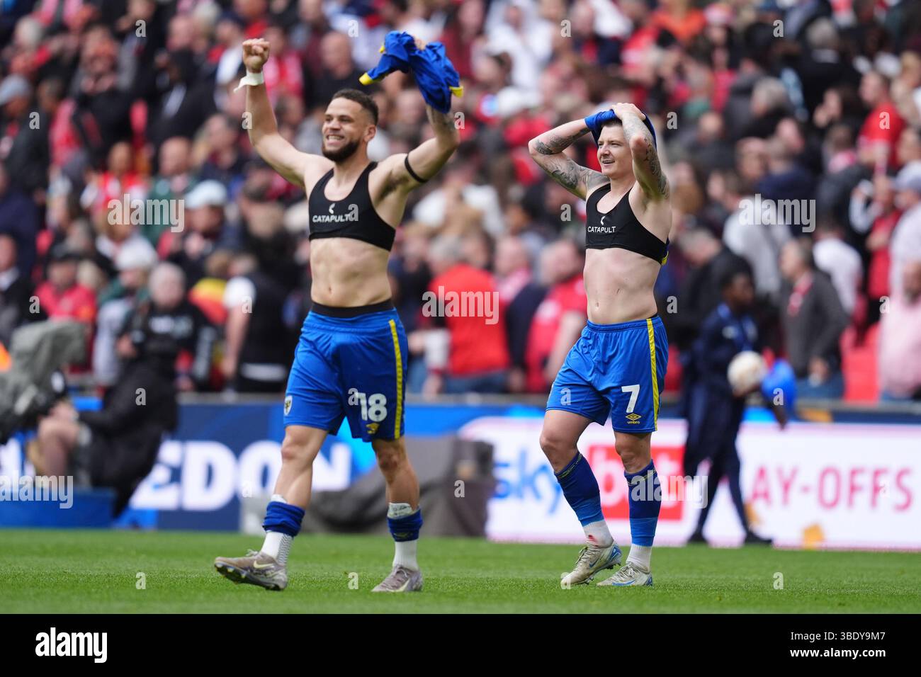 AFC Wimbledon's Marcus Browne (left) and AFC Wimbledon's James Tilley ...
