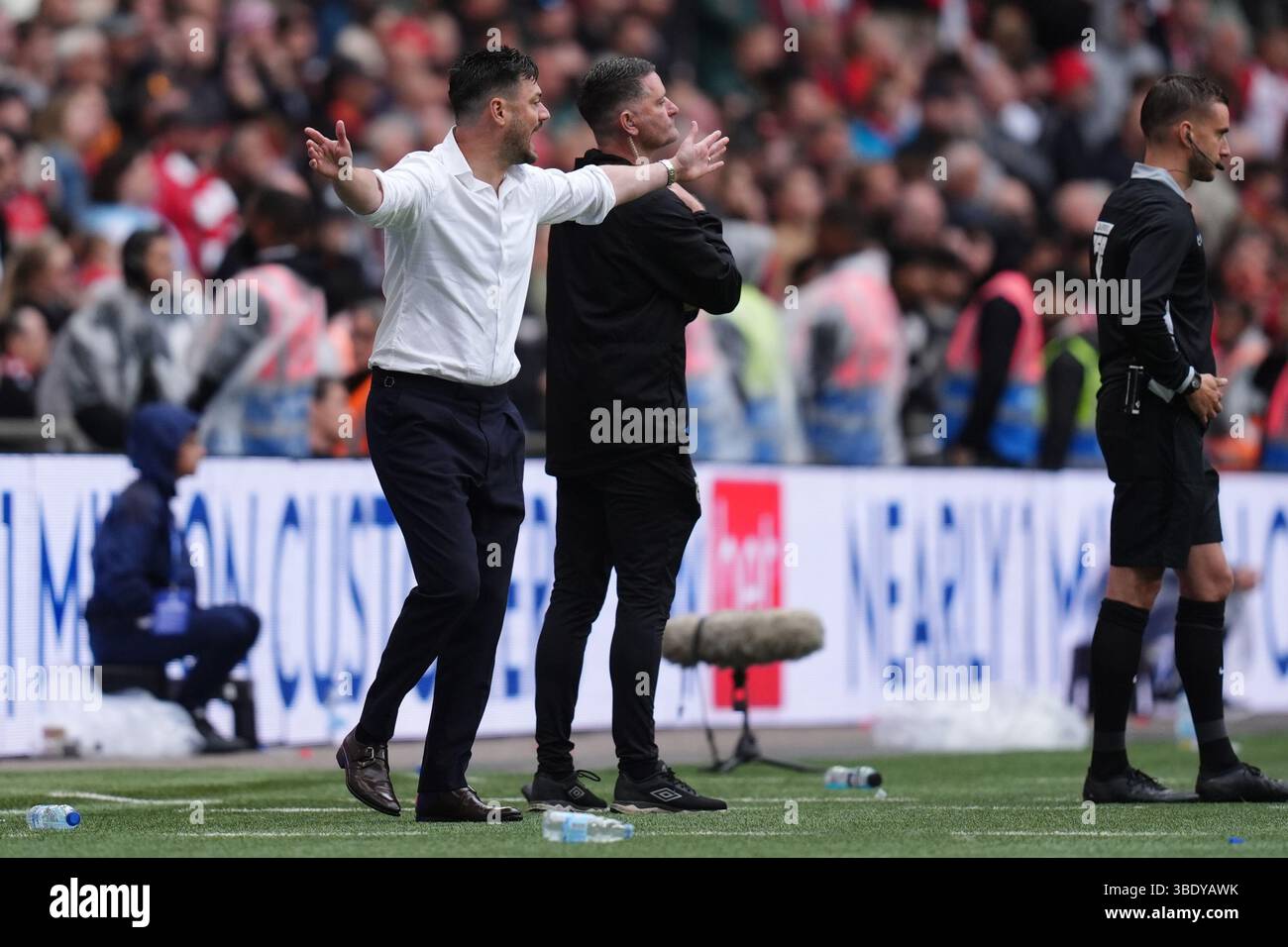 AFC Wimbledon manager Johnnie Jackson celebrates on the final whistle ...