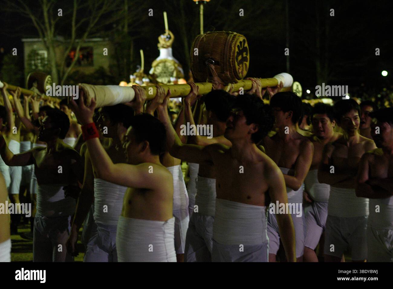 Men in loincloths performs a ritual for good luck to residents during ...