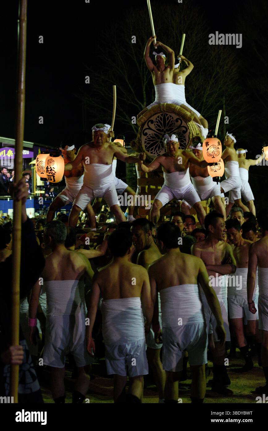 Men in loincloths performs a ritual for good luck to residents during ...