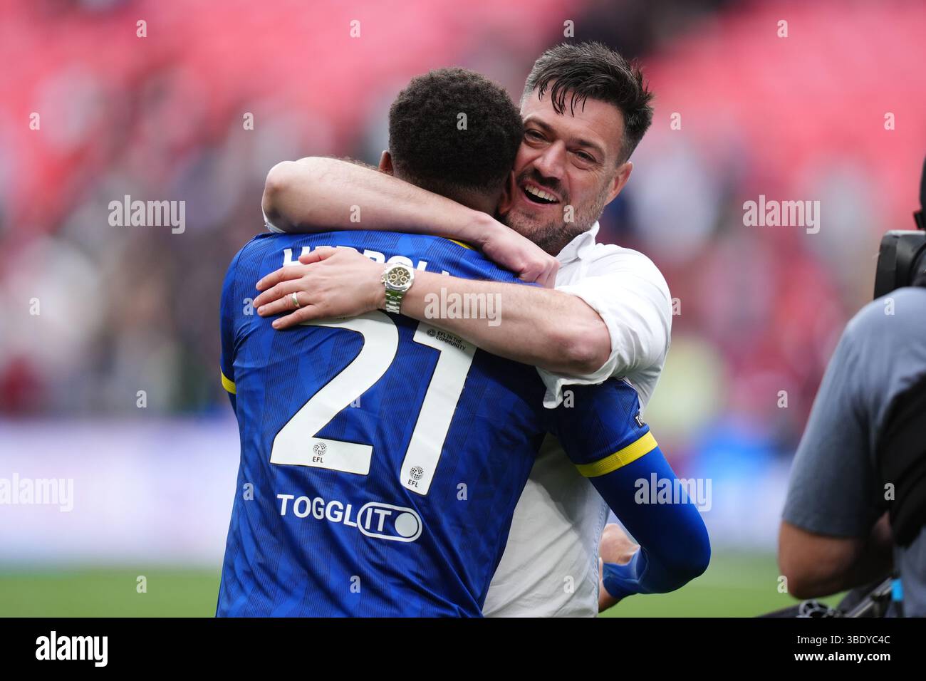 AFC Wimbledon manager Johnnie Jackson (right) and AFC Wimbledon's Myles ...
