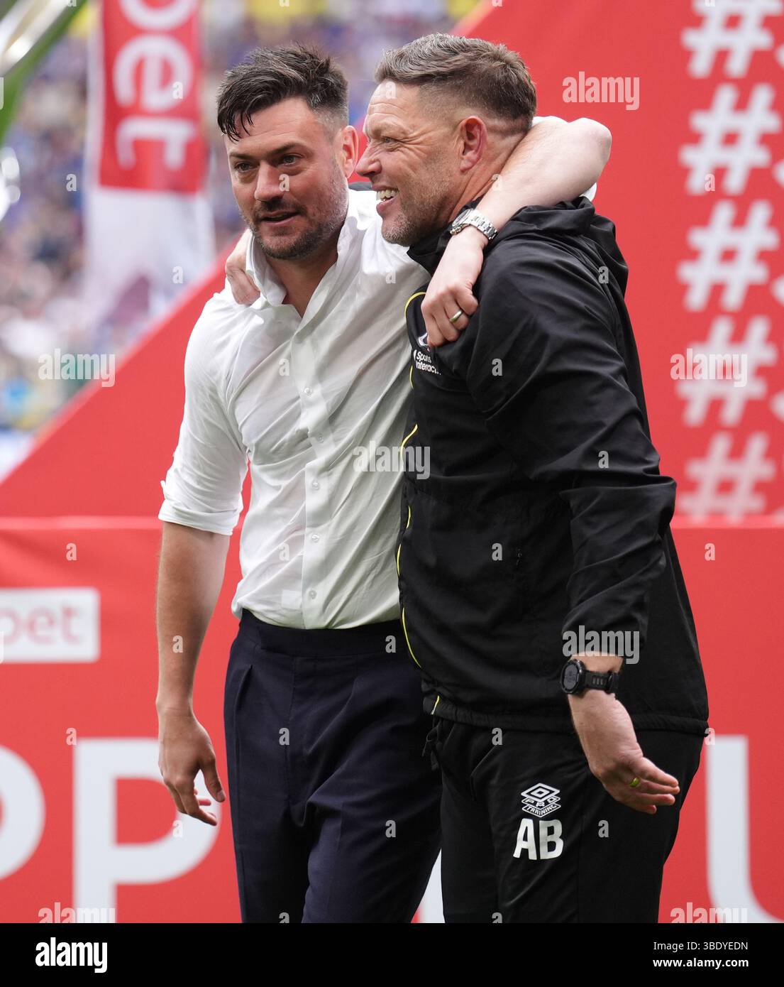 AFC Wimbledon manager Johnnie Jackson (left) after the final whistle ...