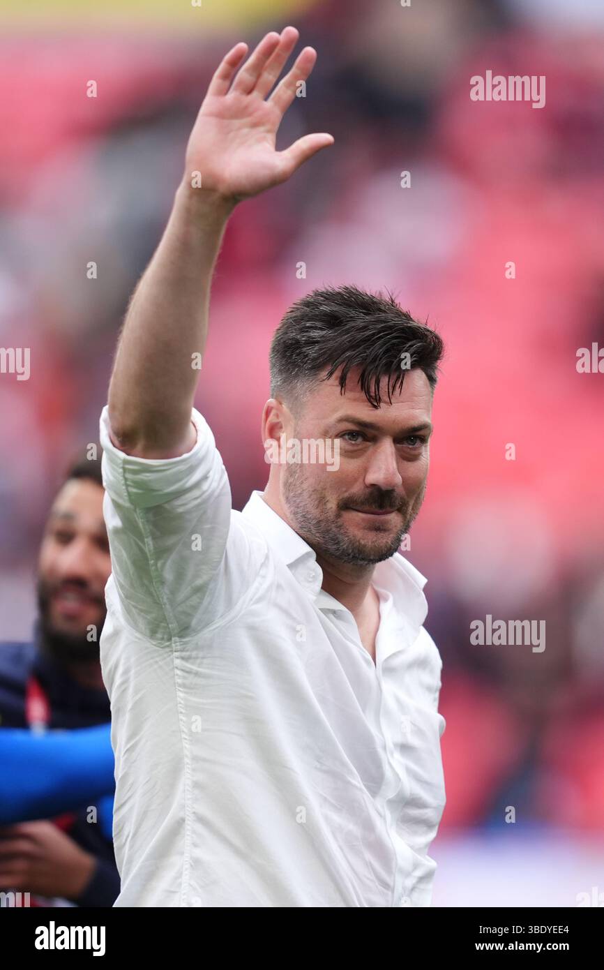 AFC Wimbledon manager Johnnie Jackson celebrates after the final ...
