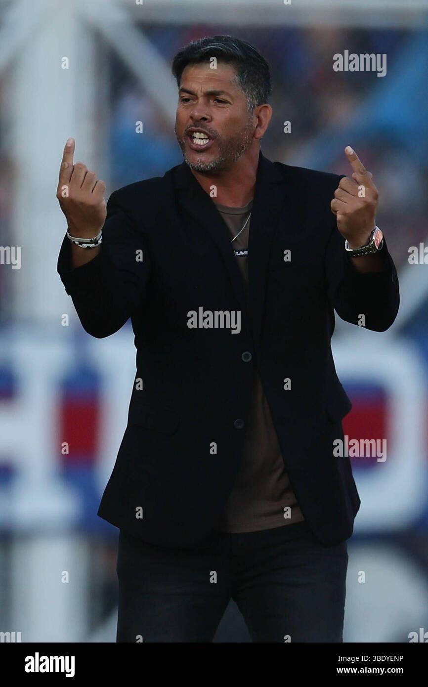 Platense s head coach Sergio Gomez gives instructions during the ...