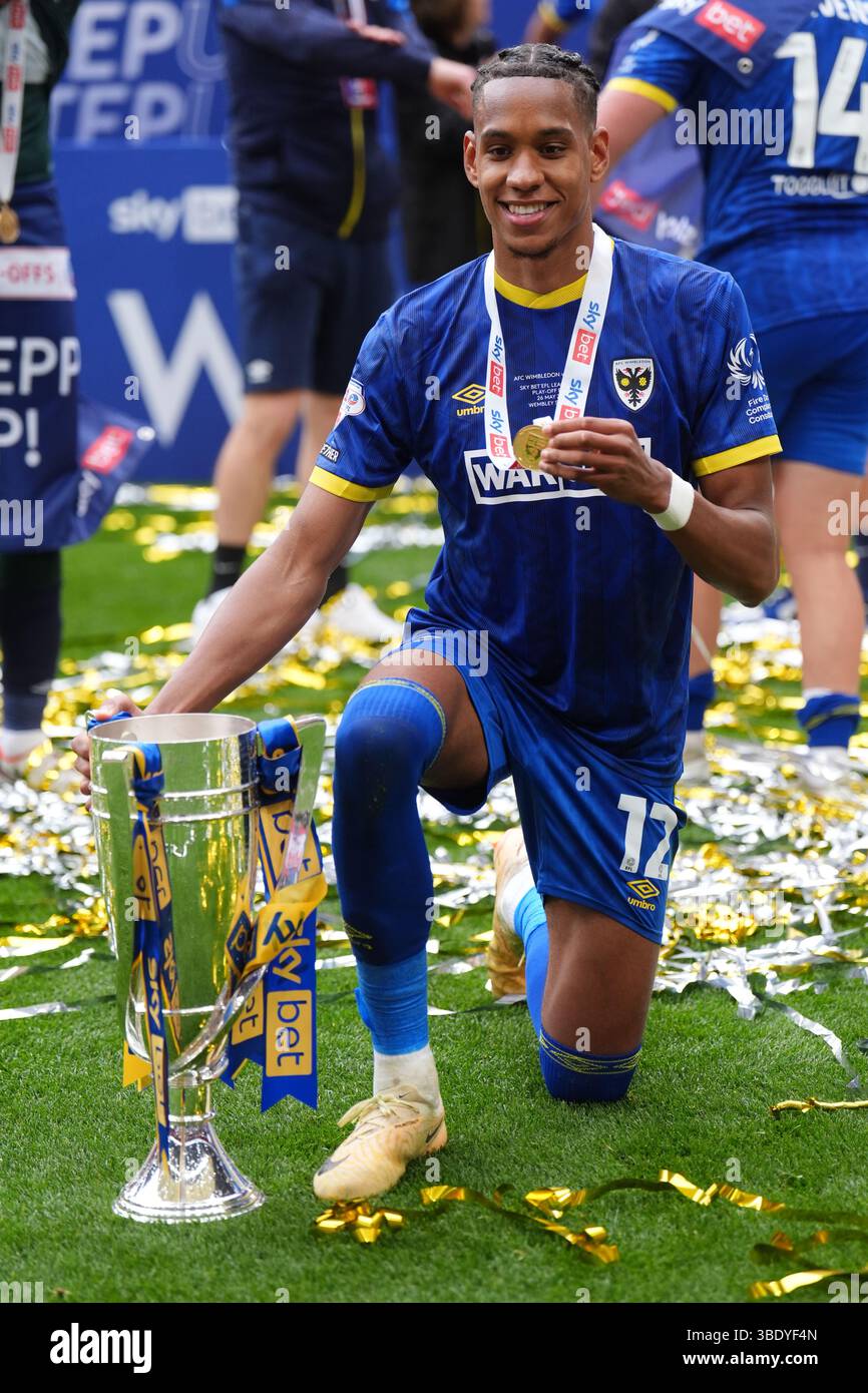 AFC Wimbledon's Alistair Smith with the trophy after the Sky Bet League Two play off final at ...