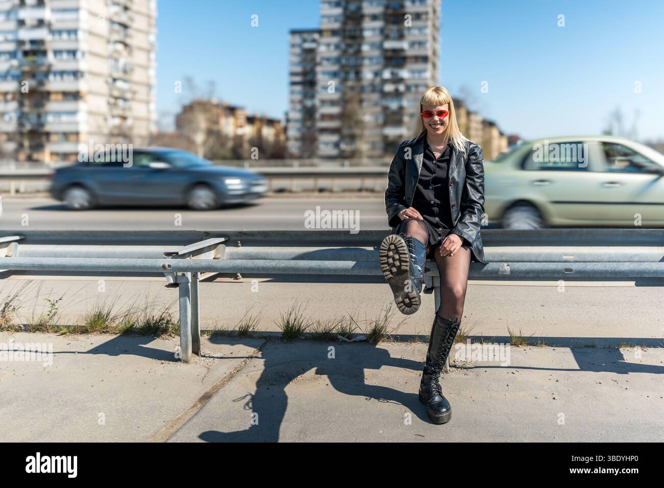 Punk style fashion girl in black edgy outfit with leather jacket and ...