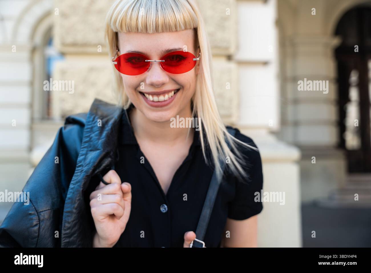 Punk style fashion girl in black edgy outfit with leather jacket and ...