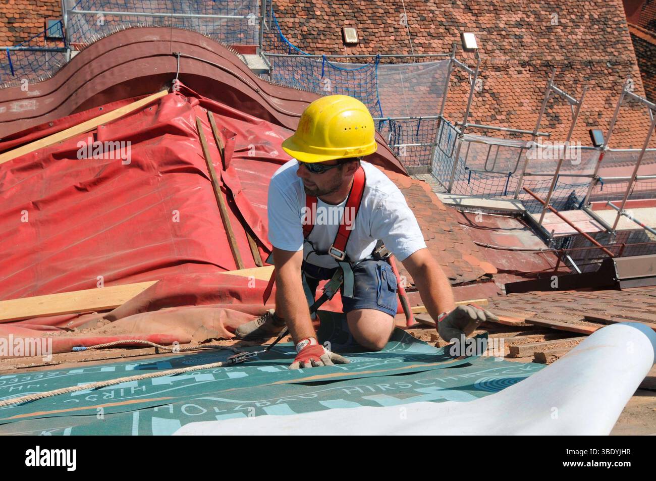 Construction worker or roofer on the roof of a building Construction ...