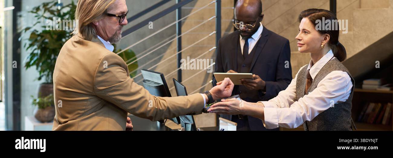 Two professionals having handshake in modern office setting with ...