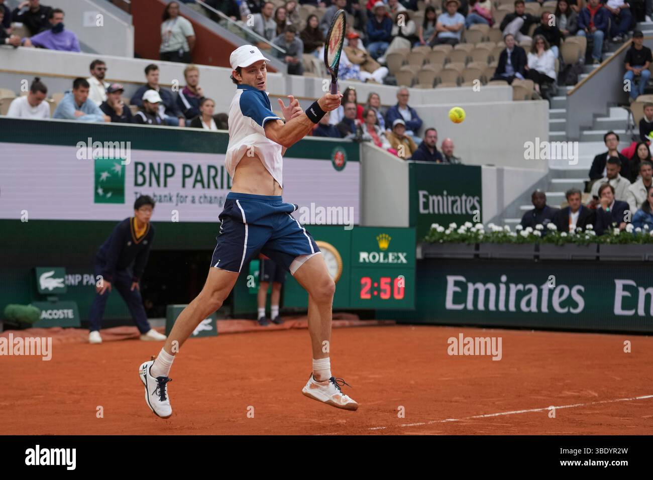 Chile's Nicolas Jarry hits a forehand against France's Arthur Fils ...