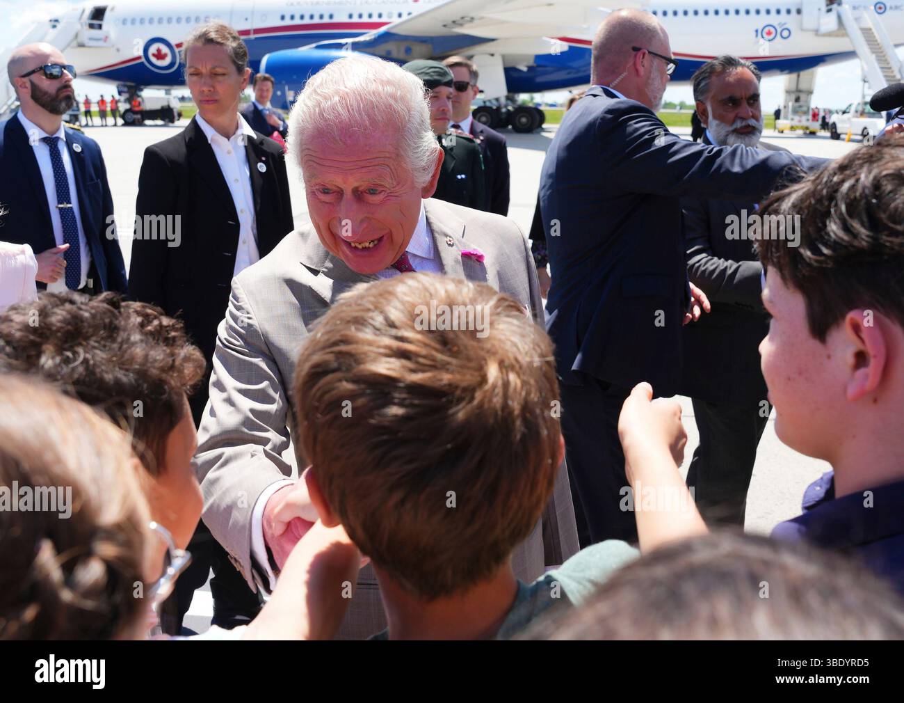 King Charles greets school children as he arrives at the Ottawa ...