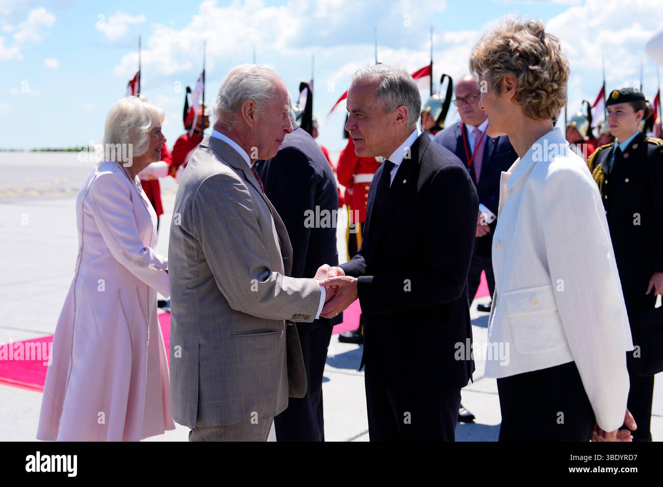 Canada Prime Minister Mark Carney greets King Charles as he and Queen Camilla arrive at the ...