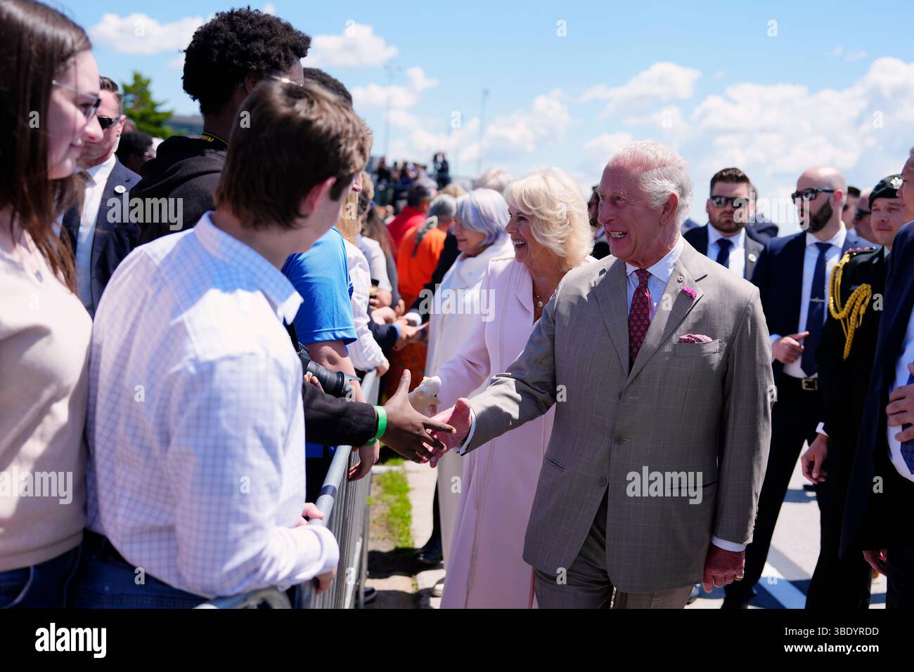 King Charles and Queen Camilla meet students as they arrive at the ...