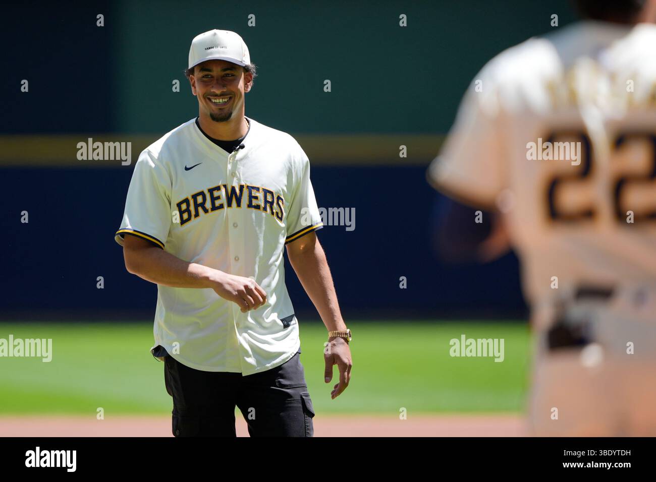 Green Bay Packers' quarterback Jordan Love smiles after throwing out a ...