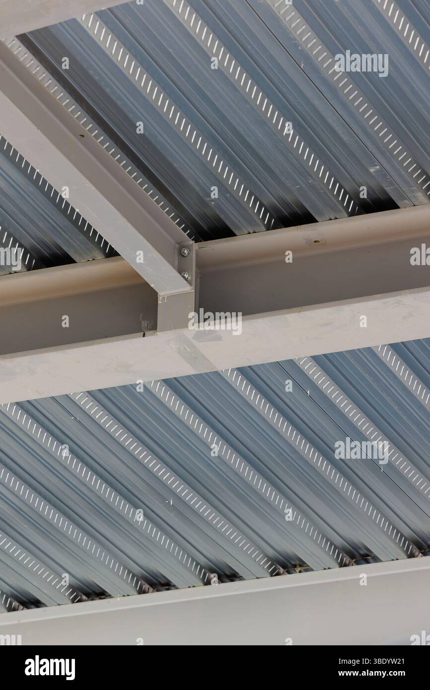 Metal decking underside and steal beams with white fire retardant ...