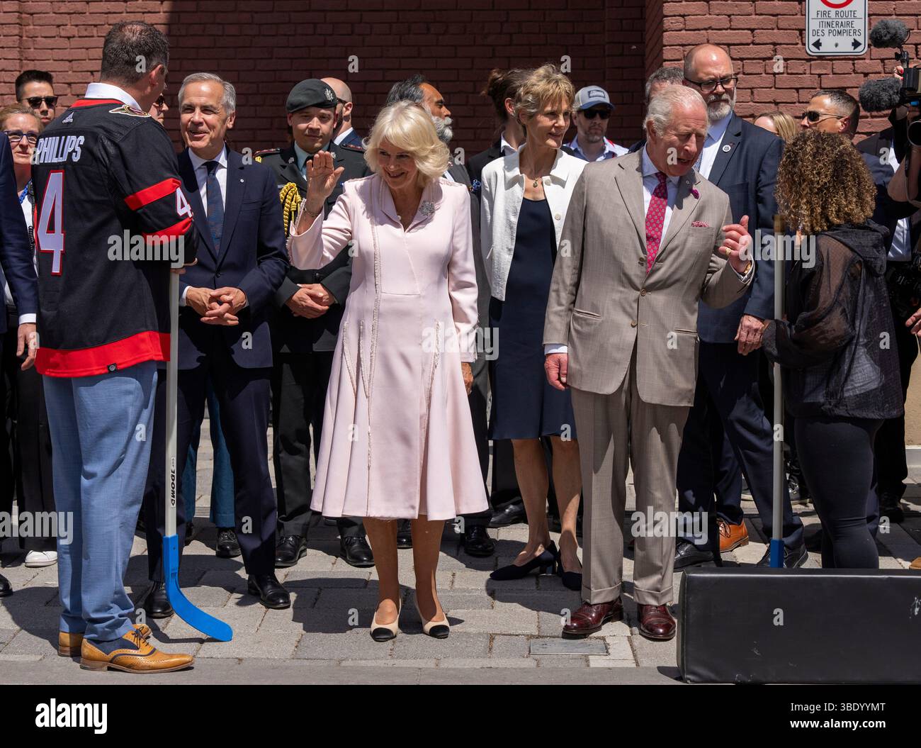 Queen Camilla waves as Prime Minister Mark Carney and King Charles ...